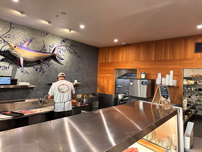 Where the magic begins—skilled hands transforming the day's catch into culinary masterpieces. This is seafood respect in its purest form.