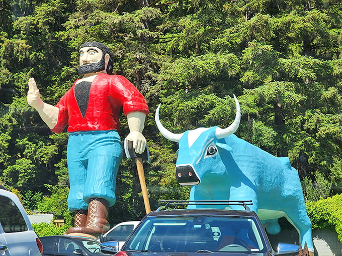 The dynamic duo in all their glory—Paul forever waving and Babe forever blue, a perfect pairing of American folklore and roadside kitsch.