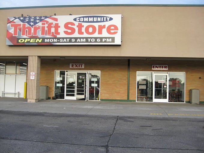 The storefront sign promises treasures within – open Monday through Saturday for your secondhand shopping adventures.