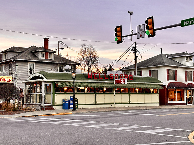 As dusk settles over Main Street, the Wellsboro Diner's illuminated sign glows like a beacon for hungry travelers and nostalgic locals alike.