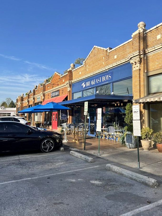 The historic brick storefront houses breakfast dreams behind its blue awning, with outdoor seating that beckons you to start your day right.