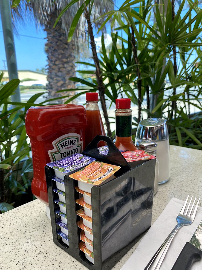 The universal diner table setup—ketchup, hot sauce, jam packets, and salt. These humble ingredients are the supporting cast to breakfast's main characters.