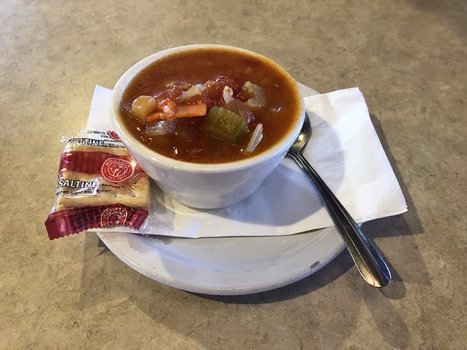 Vegetable soup that actually contains vegetables—a revolutionary concept served with saltines for proper Southern dunking protocol.