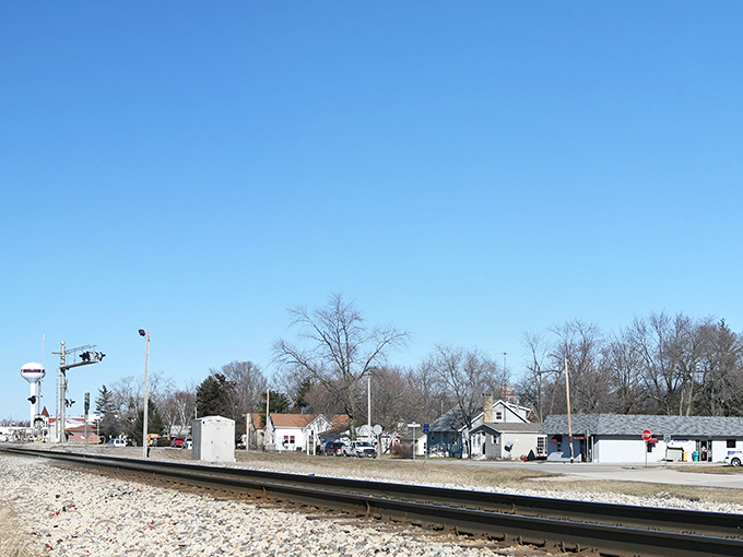 Railroad tracks stretch toward the horizon, a reminder that Arcola owes its existence to the Illinois Central Railroad that still sends freight rumbling through town daily.