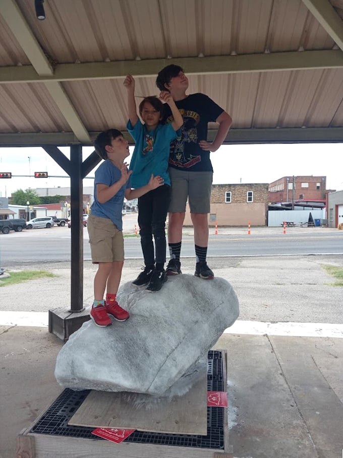 Kids conquering the salt mountain! This outdoor exhibit lets young explorers stand triumphantly atop what might be the world's most lickable landmark.