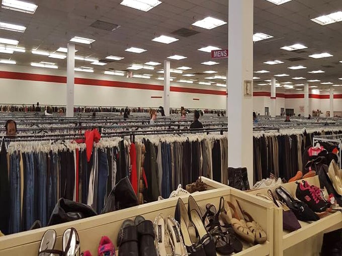 An ocean of clothing racks stretches to the horizon, with shoes patiently waiting in the foreground for their perfect match.