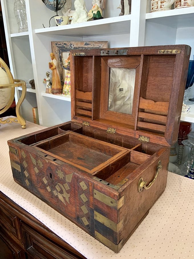 A handcrafted wooden box with intricate inlay work—the kind of treasure that makes you wonder about all the secrets it once held.