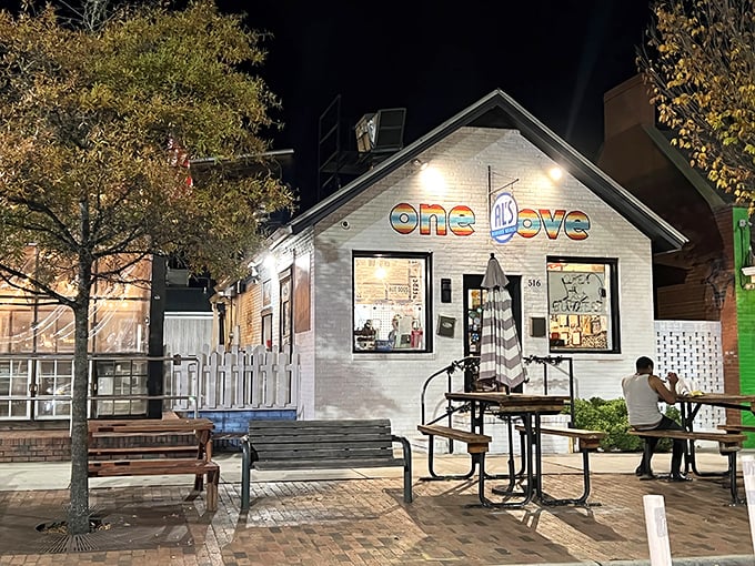 Al's Burger Shack at night, glowing with promise. That "one love" sign isn't just decoration—it's a burger philosophy in action.