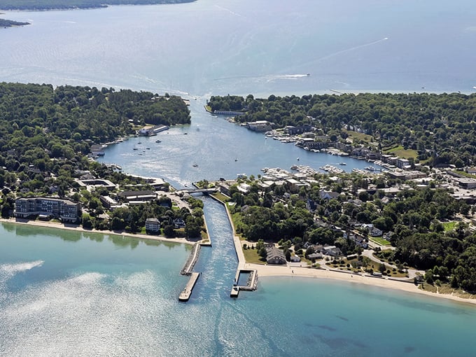 Charlevoix's waterways connect like nature's perfect handshake, where Lake Michigan meets Lake Charlevoix in a blue embrace.