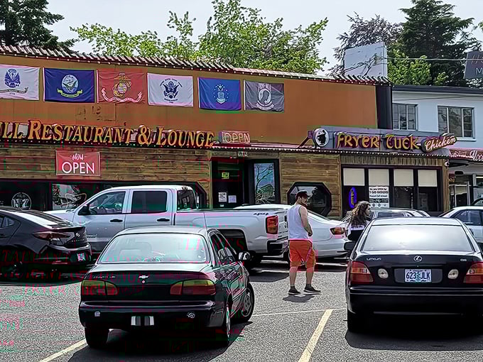 The rustic log cabin exterior of Fryer Tuck promises chicken worth clucking about. Military flags add patriotic charm to this Portland treasure.