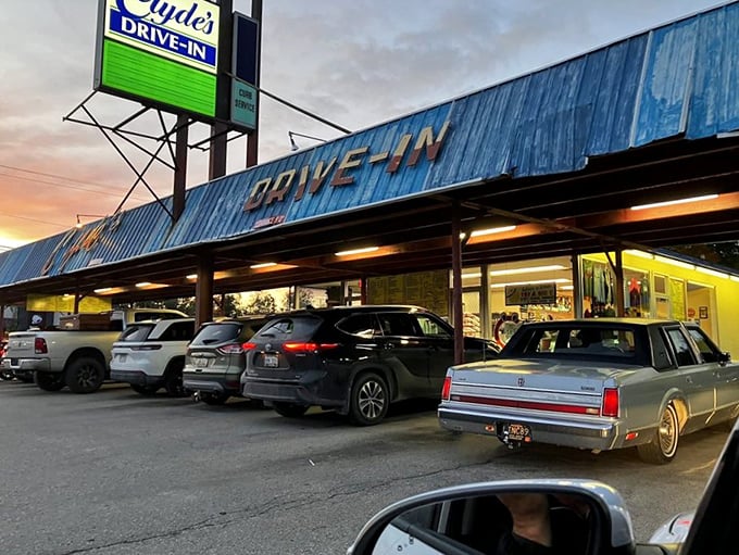 That blue canopy beckoning like a roadside beacon - Clyde's knows how to welcome weary travelers properly.