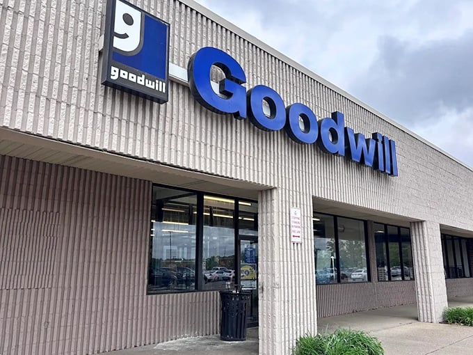 The iconic blue Goodwill sign beckons like a lighthouse for bargain hunters. Step inside for treasures waiting to be discovered!
