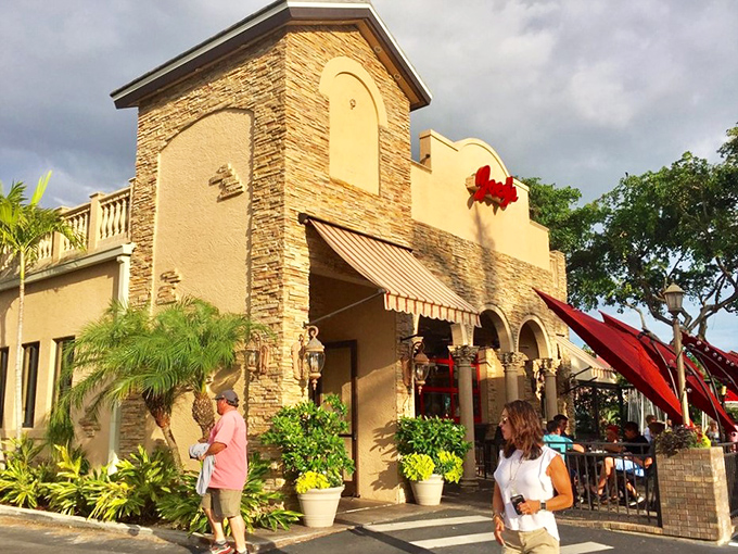 Joey's Pizza exterior beckons with Mediterranean charm. That stone facade isn't just pretty—it promises authentic flavors waiting inside.