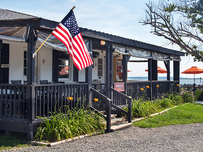 A waterfront shack with more flavor than flash! Merroir's porch and American flag welcome seafood lovers to this riverside gem.