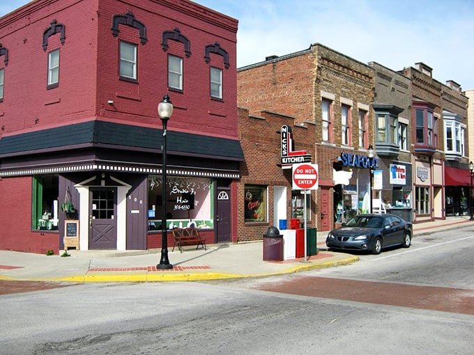 Downtown Huntington's brick beauties hide treasures inside – Nick's Kitchen waits behind that charming red awning. 