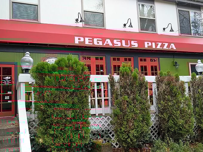 Pegasus Pizza's bold red awning isn't just eye-catching—it's like a beacon calling all hungry mortals to pizza paradise.