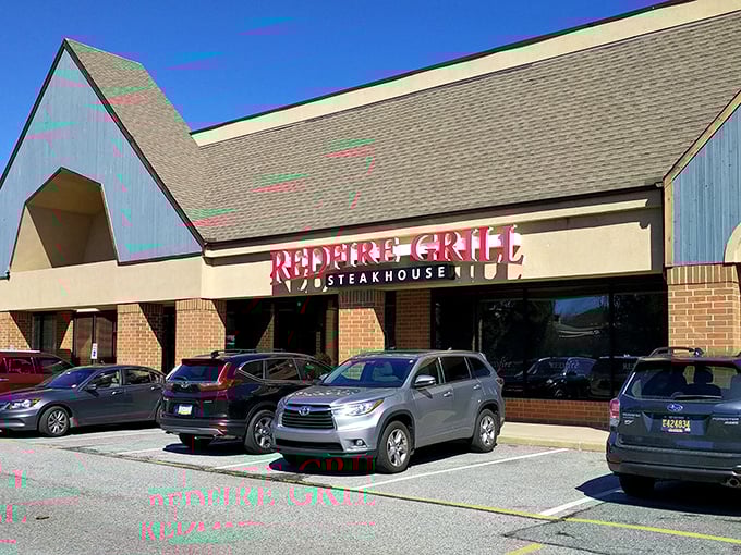 The brick-and-beam exterior of Redfire Grill promises what lies within – serious steak business with zero pretension.