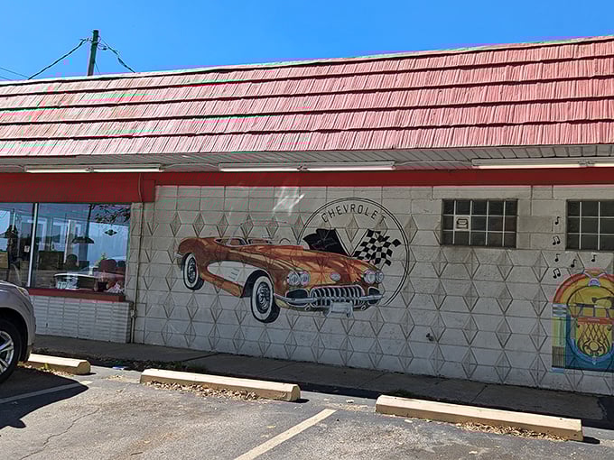 The classic Chevy mural at Rock-Cola 50's Cafe isn't just decoration—it's a time portal to when cars had fins and milkshakes had personality.