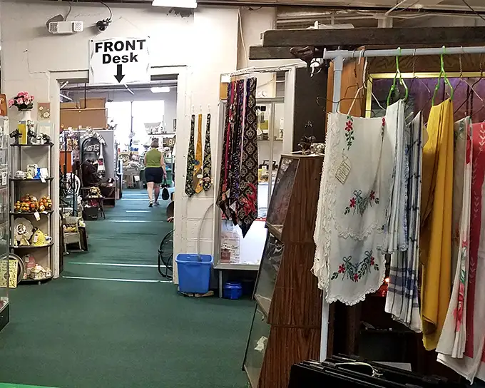 Welcome to treasure hunter heaven! The front desk at Roscoe Woodstock Antique Mall points the way to vintage neckties and embroidered linens galore.