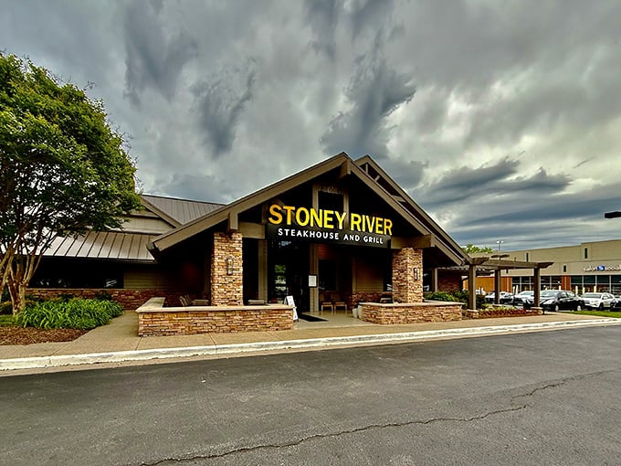 The stone facade of Stoney River beckons like a mountain lodge that happens to serve steaks that would make a cowboy weep with joy.
