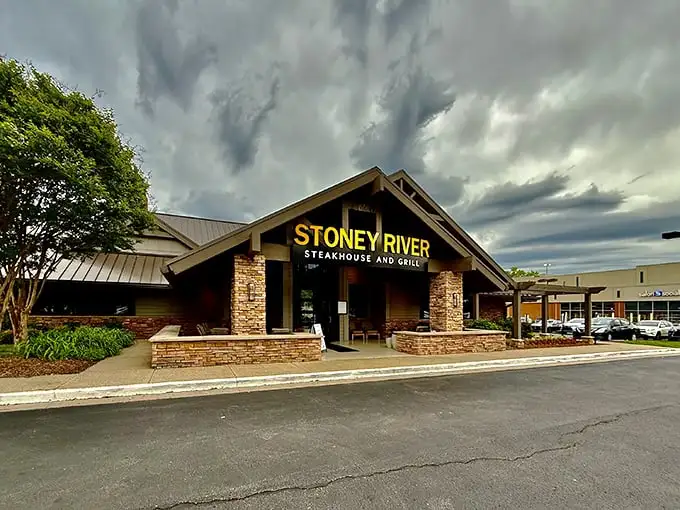 The stone facade of Stoney River beckons like a mountain lodge that happens to serve steaks that would make a cowboy weep with joy.
