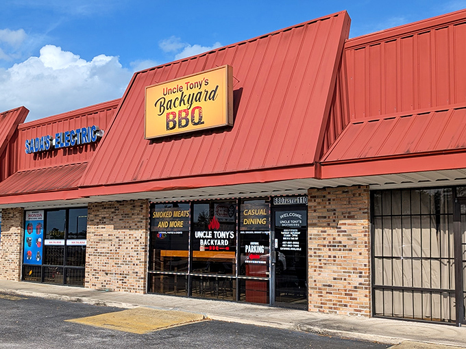 Uncle Tony's exterior beckons with that classic red roof – like a barbecue bat signal calling hungry heroes home!