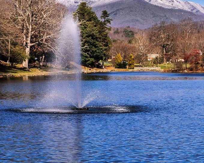 This fountain dances in the sunlight, with mountains standing guard like nature's own retirement committee.