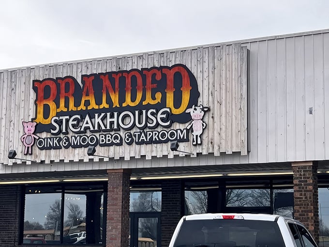 That sign says it all – "Oink & Moo" – where cartoon livestock promise serious business when it comes to steaks and BBQ.