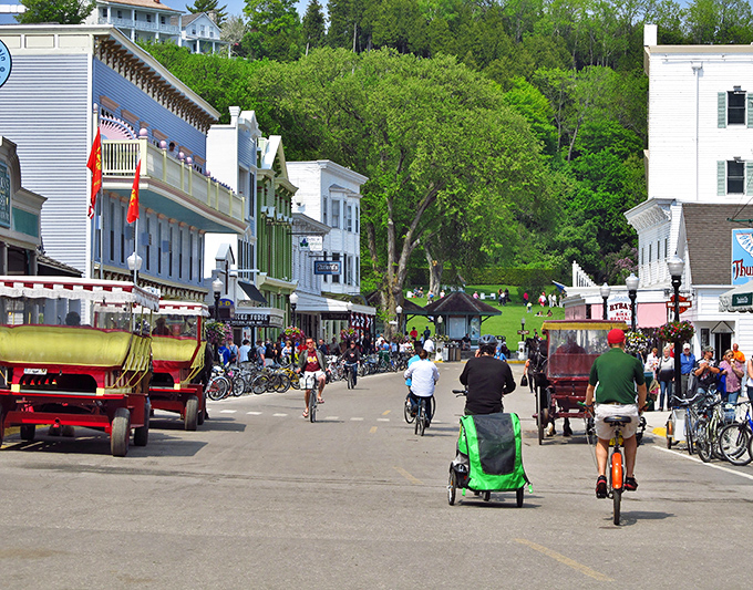 Mackinac Island's Main Street: Where horses replace horsepower and fudge shops tempt you at every corner. Time travel never looked so charming!