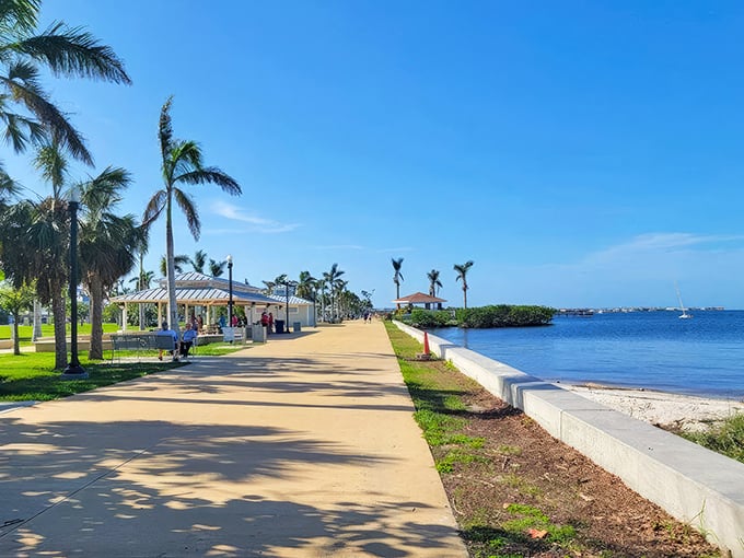 Palm trees and peaceful pathways along Punta Gorda's harborwalk—where retirement dollars stretch as far as the horizon.