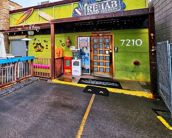 Surfboards and palm trees at Rehab Burger Therapy – desert dining with a beachy twist that'll make your taste buds do the hula.