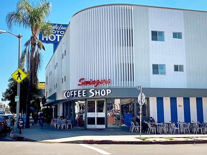 The iconic "Coffee Shop" sign at Swingers promises what every morning needs: caffeine, comfort food, and a booth where time stands still.