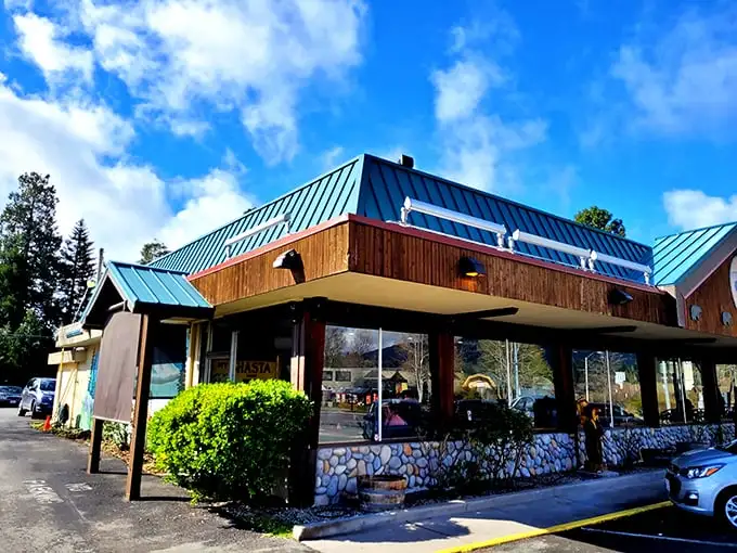 This isn't just any roadside diner—it's where locals gather for hearty breakfasts before mountain adventures. Blue roof, stone foundation, comfort food paradise.
