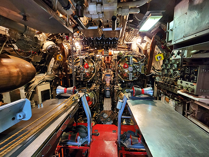 A symphony of dials, levers, and gauges – the submarine's control room looks like NASA mission control squeezed into a metal tube.