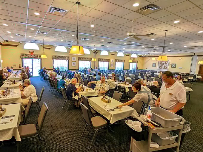 The bustling dining room speaks volumes—this isn't just a meal, it's a pilgrimage for locals and tourists seeking authentic Amish cooking in Florida's sunshine state.