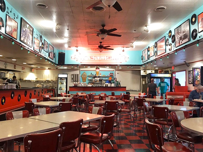 Step back in time with this classic 1950s diner aesthetic—red vinyl seats and checkerboard floors that Elvis would approve of.