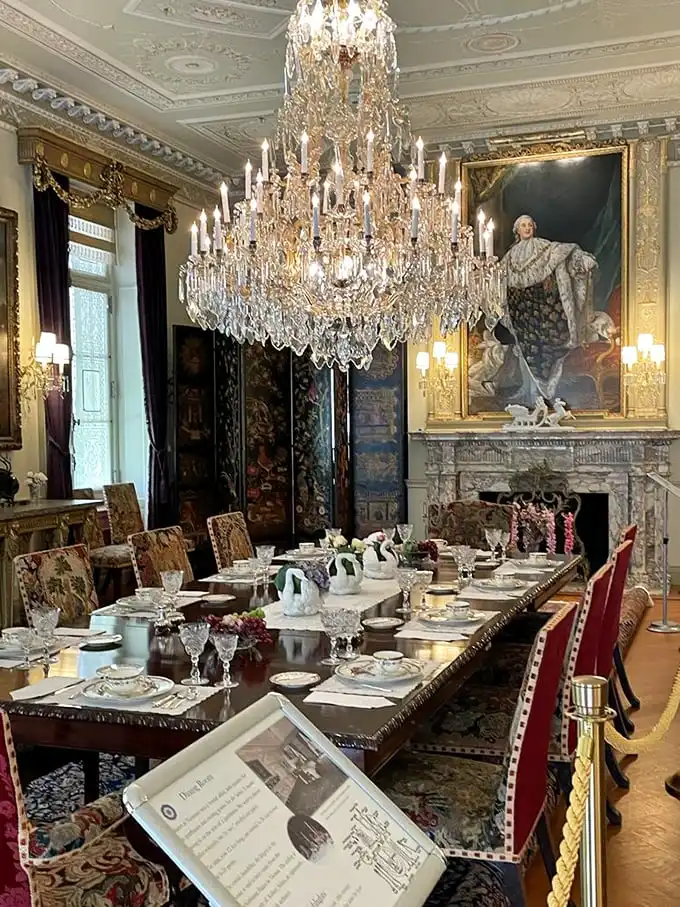 That chandelier isn't just lighting—it's jewelry for the ceiling. The dining table awaits guests who'll never arrive but are eternally expected.
