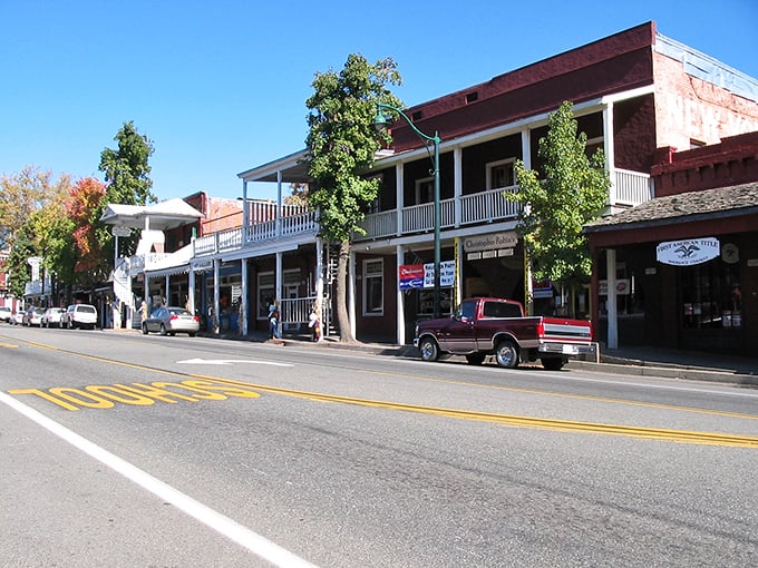 Historic storefronts line the street like old friends gathering for their daily coffee ritual. 