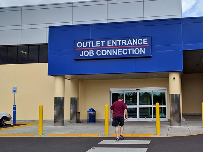 The blue entrance beckons like a portal to another dimension—one where your dollar stretches and shopping becomes an Olympic sport.