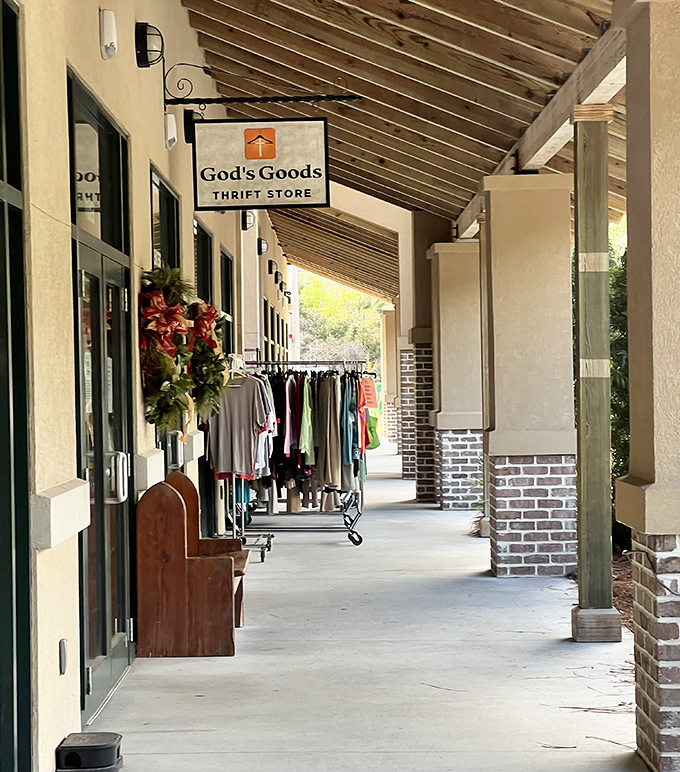 Stepping into the covered walkway feels like entering a portal to possibility. Even the clothing racks can't wait to meet their new owners.