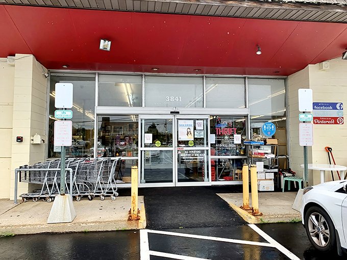 Red ceiling, shopping carts at the ready – this entrance is the gateway to possibility, where wallet-friendly adventures begin.
