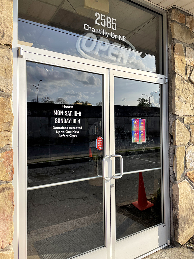Business hours posted clearly—because even treasure hunting needs a schedule. The real magic happens when those glass doors swing open to reveal a wonderland of possibilities.