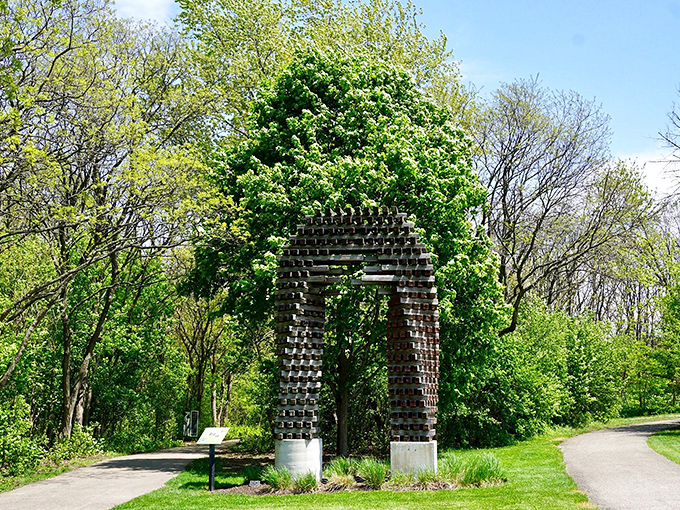 Nature and architecture embrace in this metal archway, creating a portal that practically begs you to walk through and be transformed.