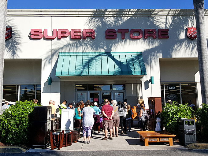 The red "SUPER STORE" sign isn't just marketing—it's truth in advertising. Note the eager shoppers already lining up for their bargain safari.