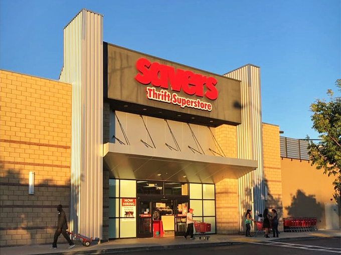 Bathed in golden California sunshine, Savers' entrance promises air-conditioned treasure hunting inside. The red shopping carts stand ready for your inevitable overflow of finds.