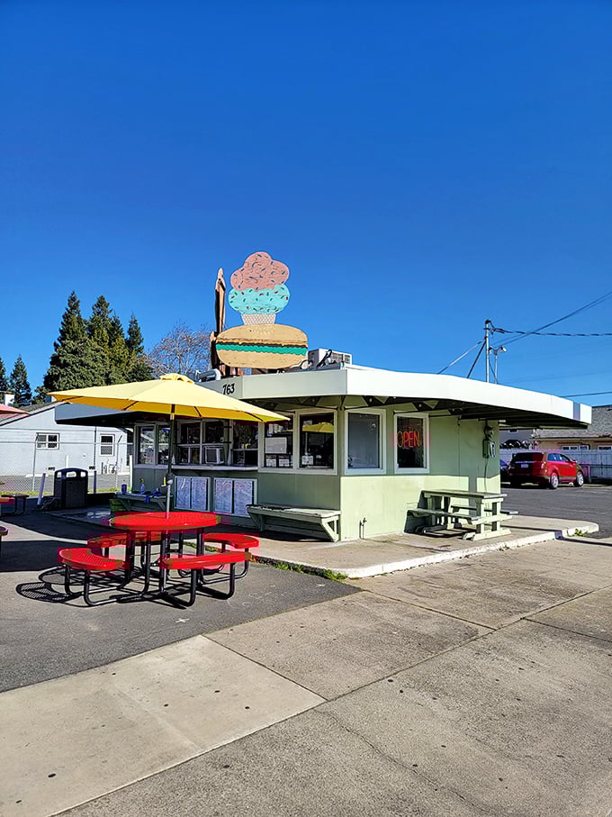 Blue skies, yellow umbrella, and a burger joint that looks like it was designed by someone who understood the importance of priorities.
