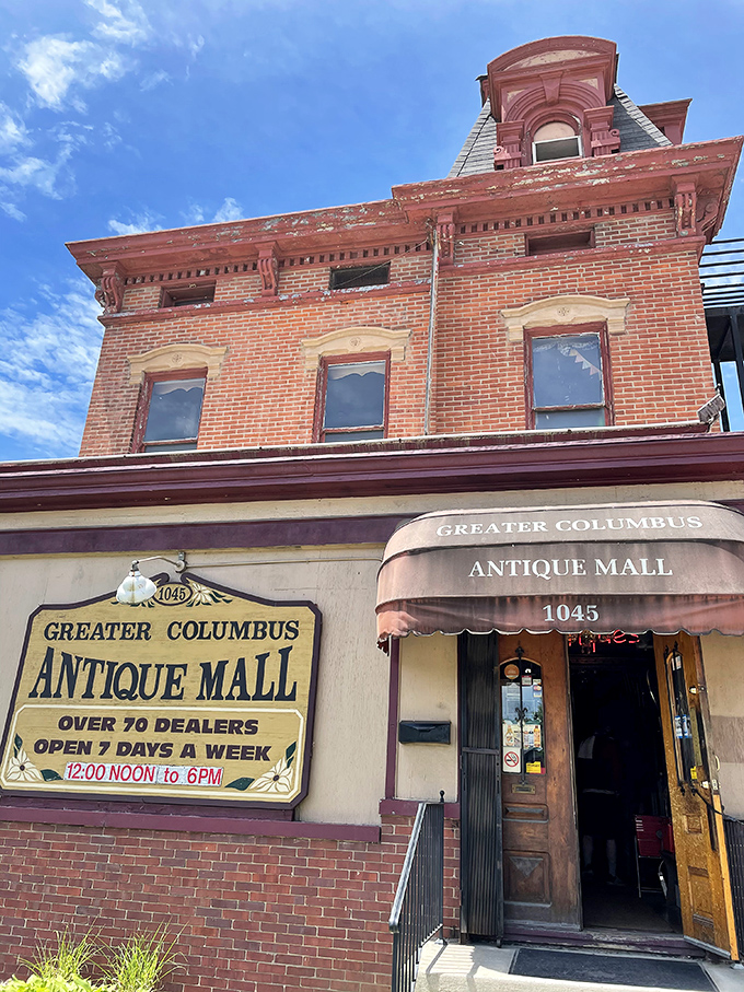 This historic brick façade isn't just pretty—it's a time portal disguised as a building, complete with that charming vintage awning.