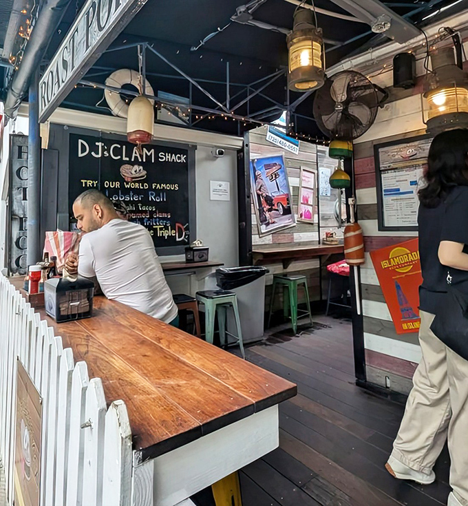 Inside DJ's, nautical charm meets culinary magic. Those hanging lanterns aren't just for show—they're illuminating seafood greatness.