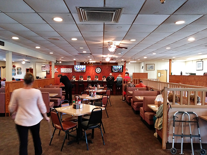 Inside, wood paneling and comfortable booths create that timeless diner atmosphere where conversations flow as freely as the coffee.