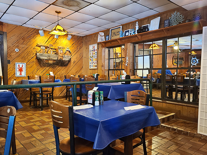 Nautical charm meets cozy comfort in this wood-paneled dining room. The lobster trap on the wall isn't just decoration—it's foreshadowing for your appetite.